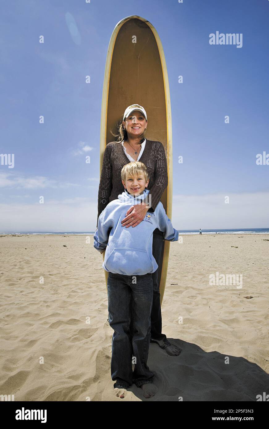 Jennifer Everett and her son Oliver, 6, stand with Todd Everett's ...