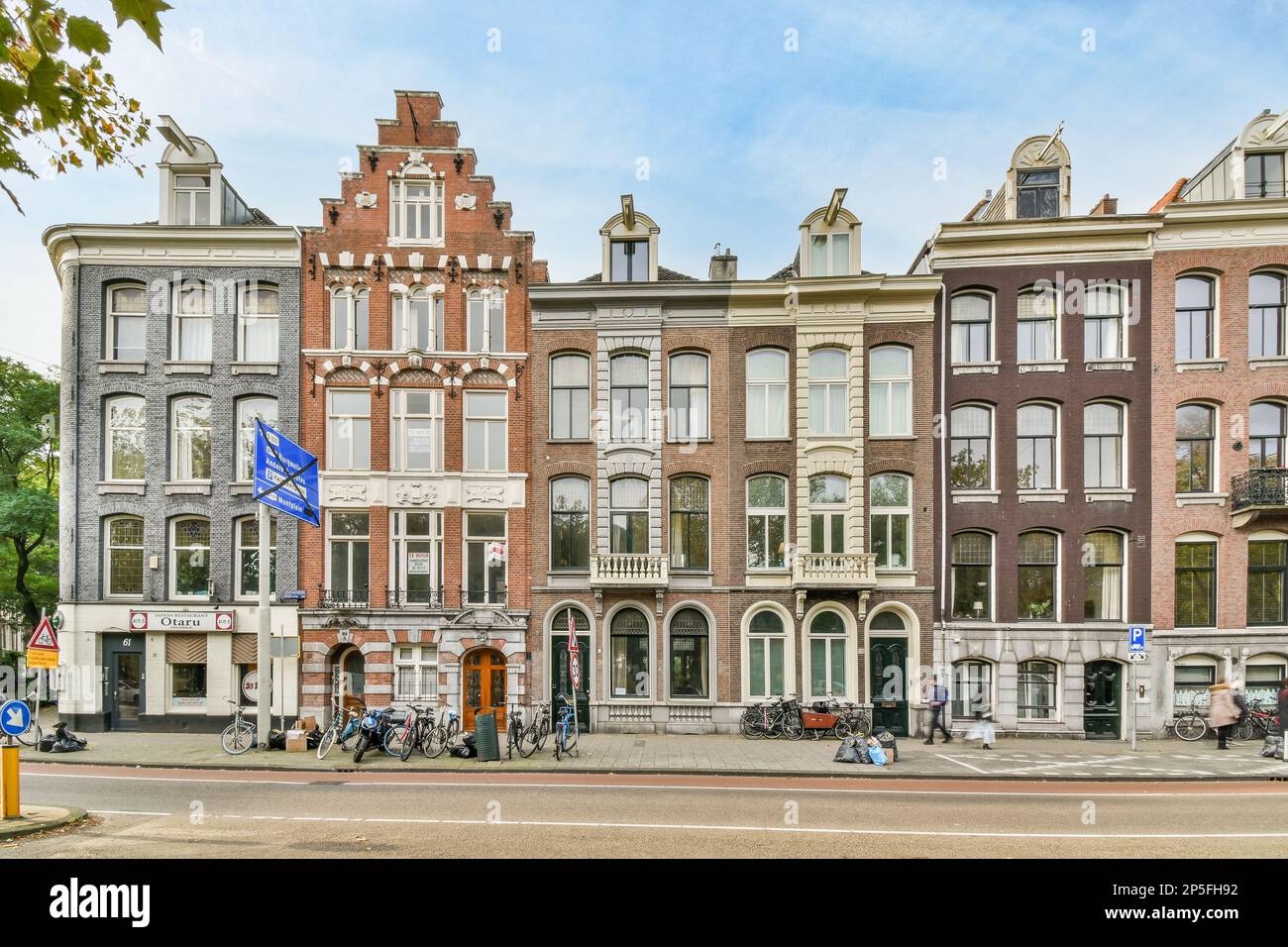 some very old buildings in the middle of an urban area with people ...