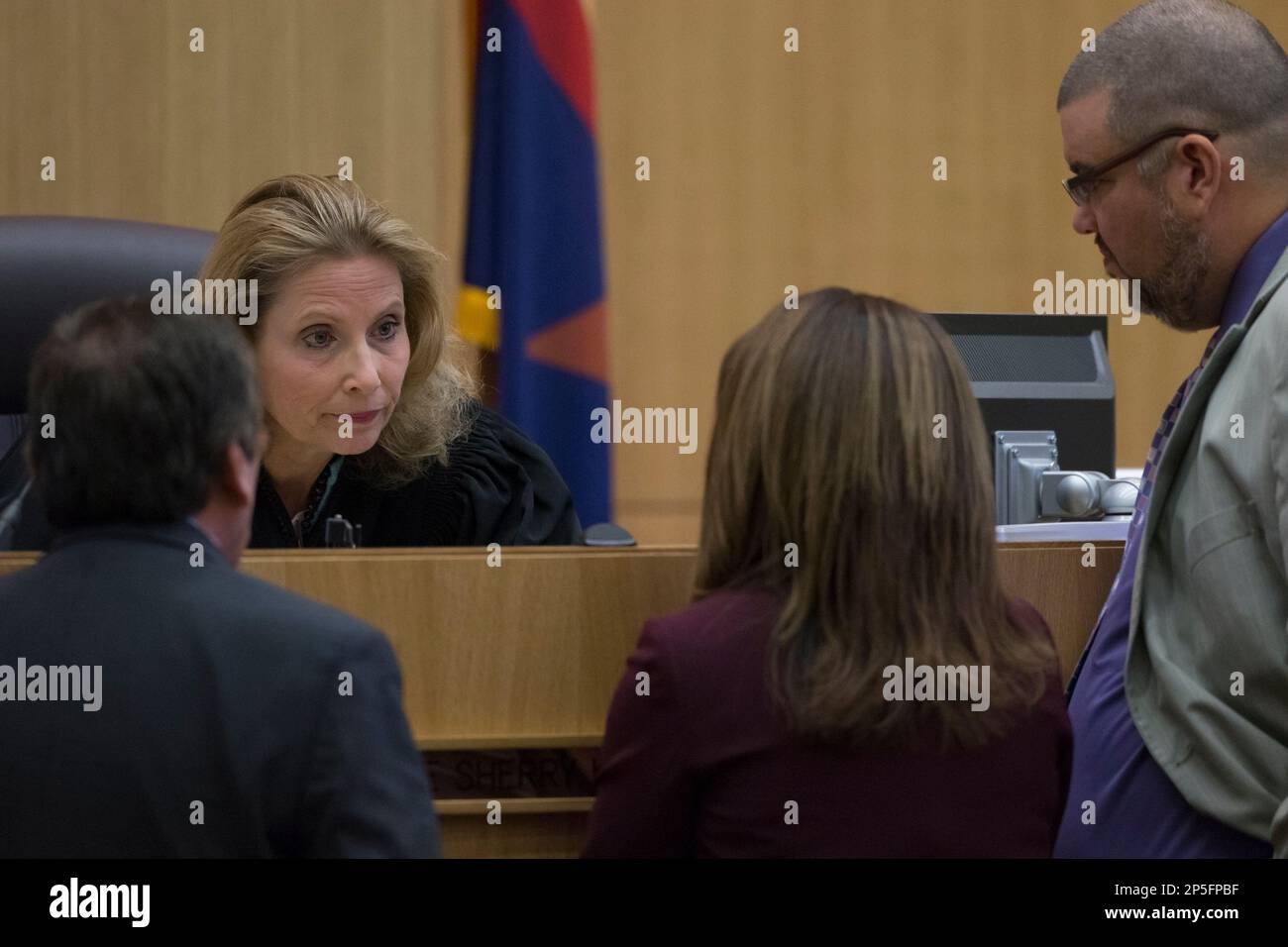 Judge Sherry Stephens, second from left, talks with prosecutor Juan ...