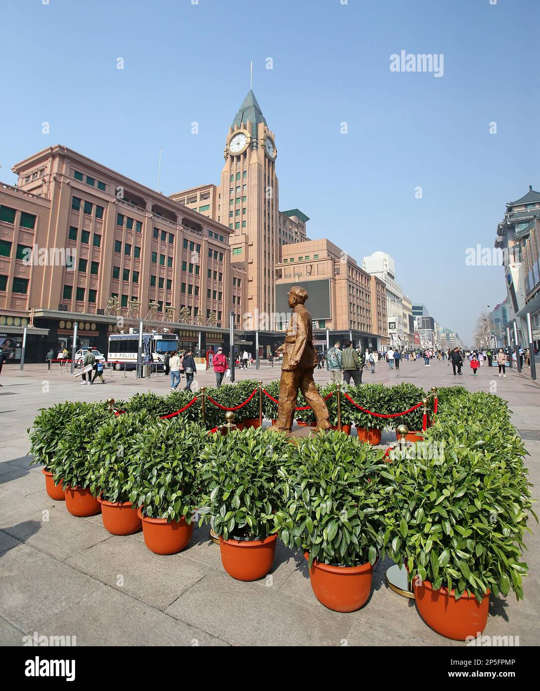 People take photos in front of the bronze statue of Lei Feng, a Chinese ...