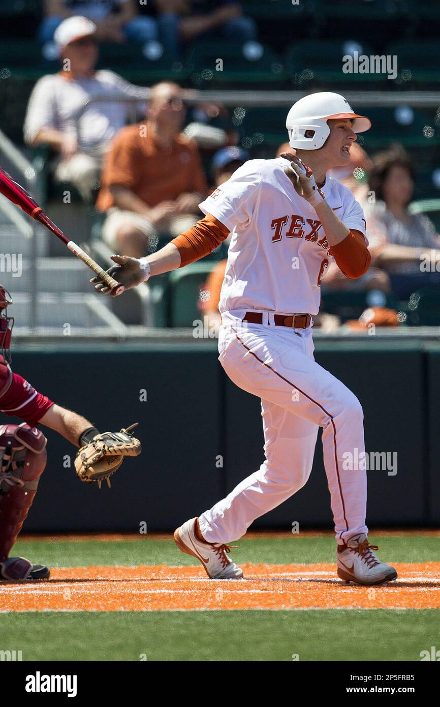 Texas Longhorns third baseman Erich Weiss #6 follows through on his ...