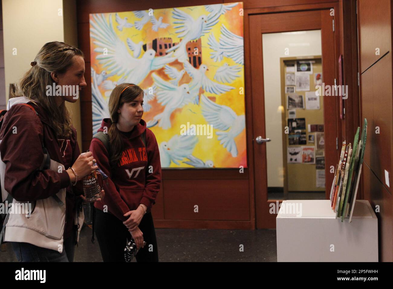Virginia Tech sophomores Melissa Ryan, left, and Abby Youmans view the ...