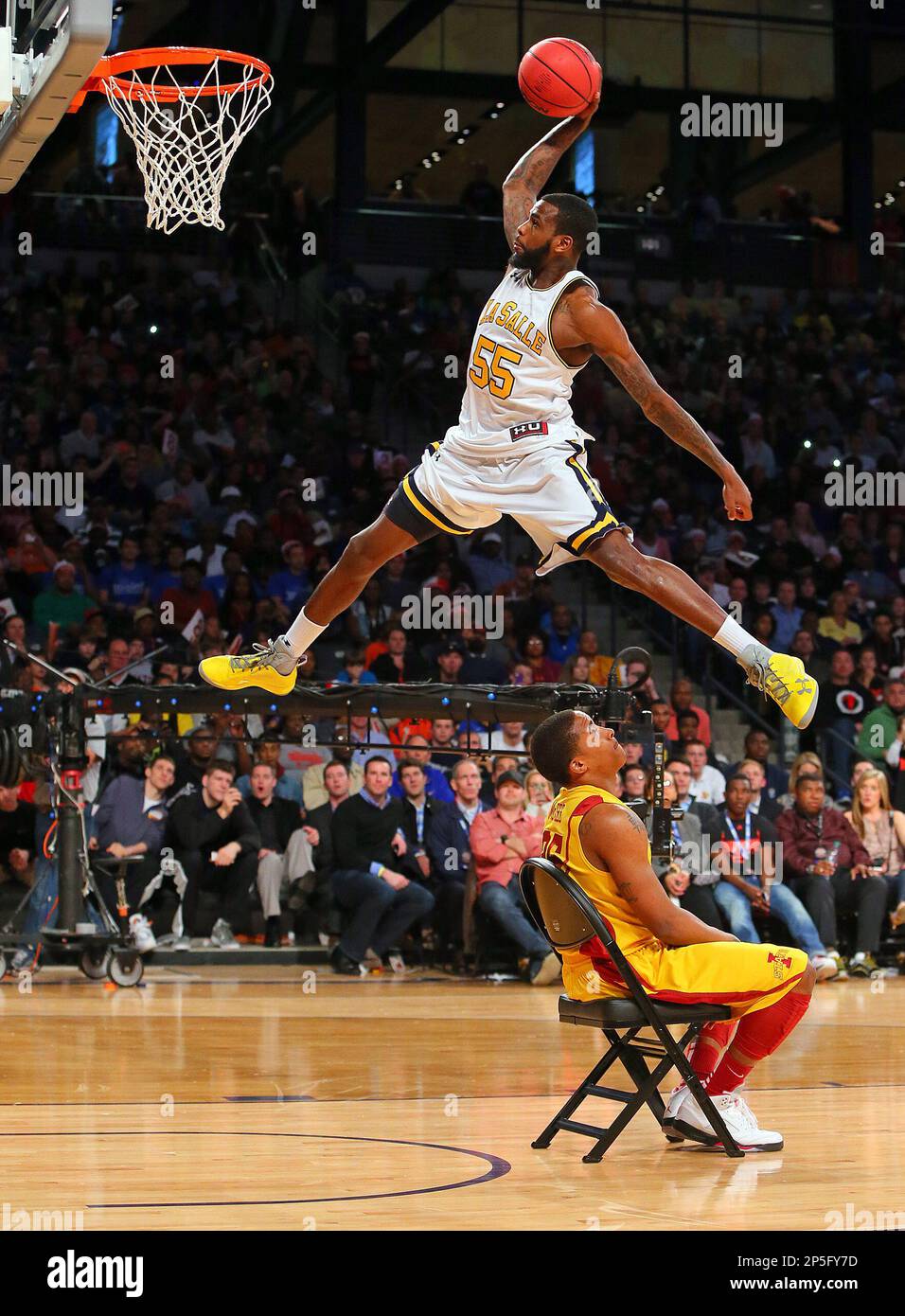 Ramon Galloway, La Salle University, climbs the stairs over a chair for ...