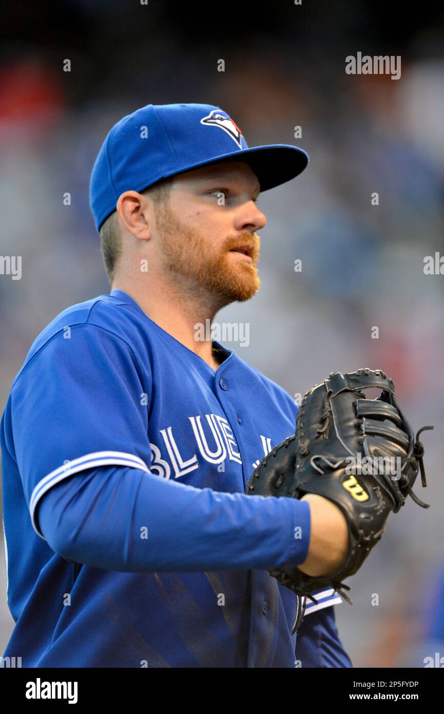 Toronto Blue Jays Adam Lind runs to the dugout between innings during a ...