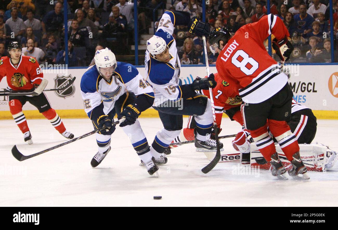 Blues center David Backes (42)and right wing Ryan Reaves compete for ...