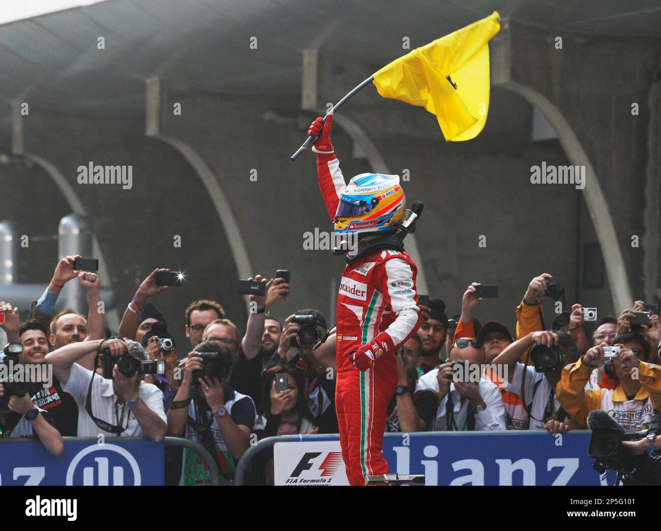 Ferrari driver Fernando Alonso of Spain celebrates after winning the ...