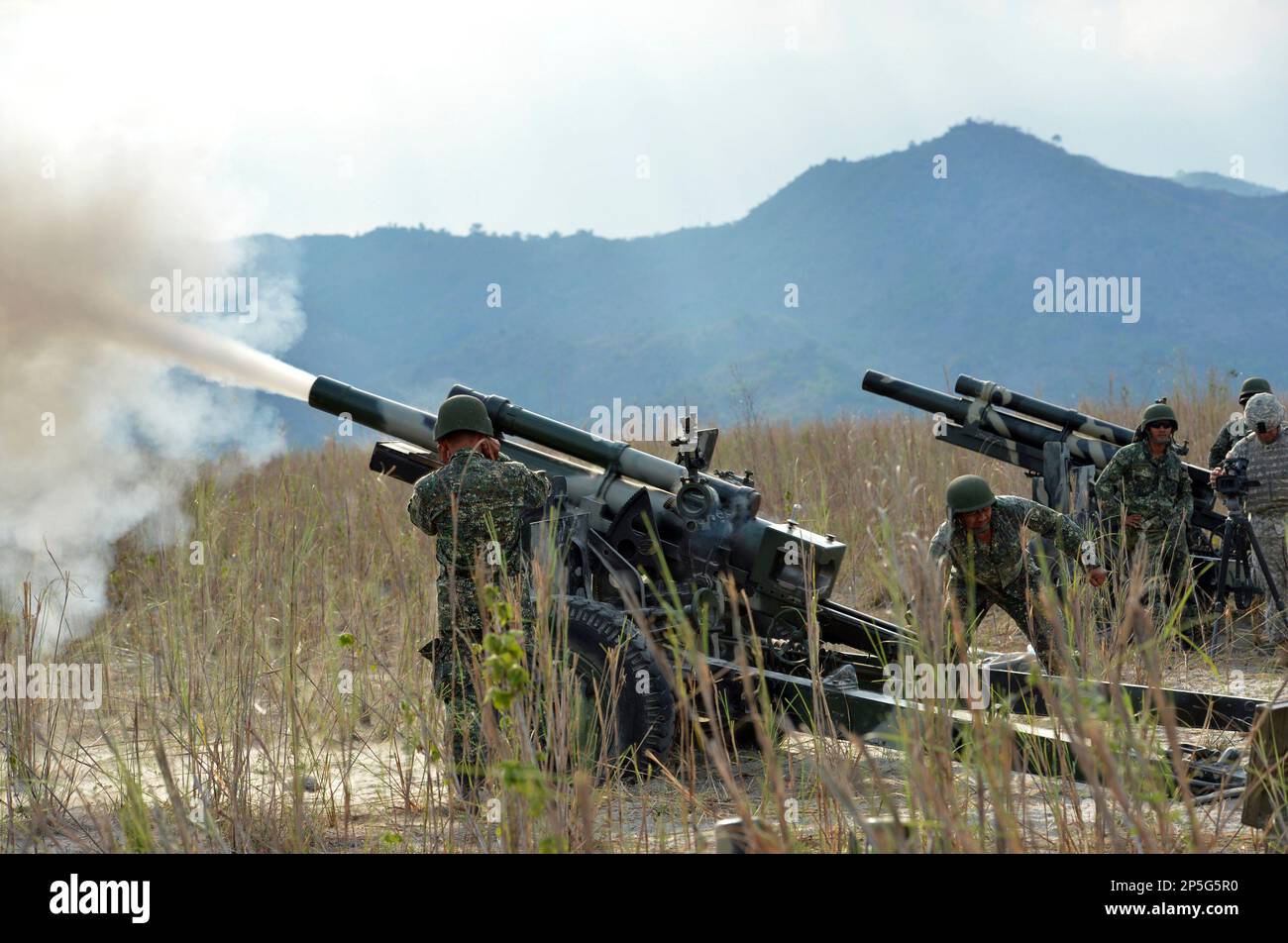 Philippine troops fire their howitzer cannon during Philippines-U.S ...