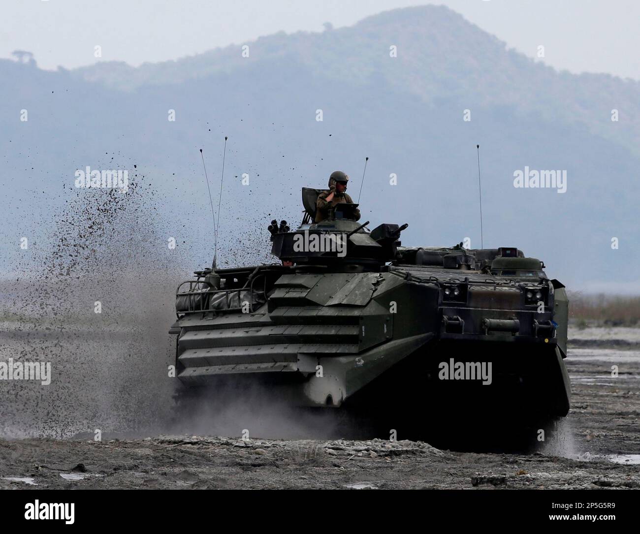 U.S. Marines, aboard their Amphibious Assault Vehicle (AAV) maneuver to ...