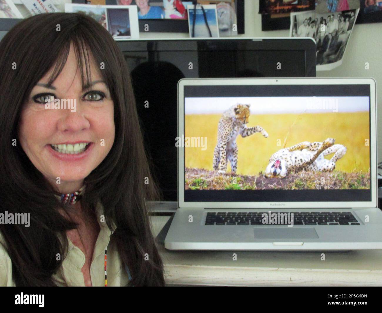 Marilyn Parver sits next to a laptop showing one of the photos she took ...