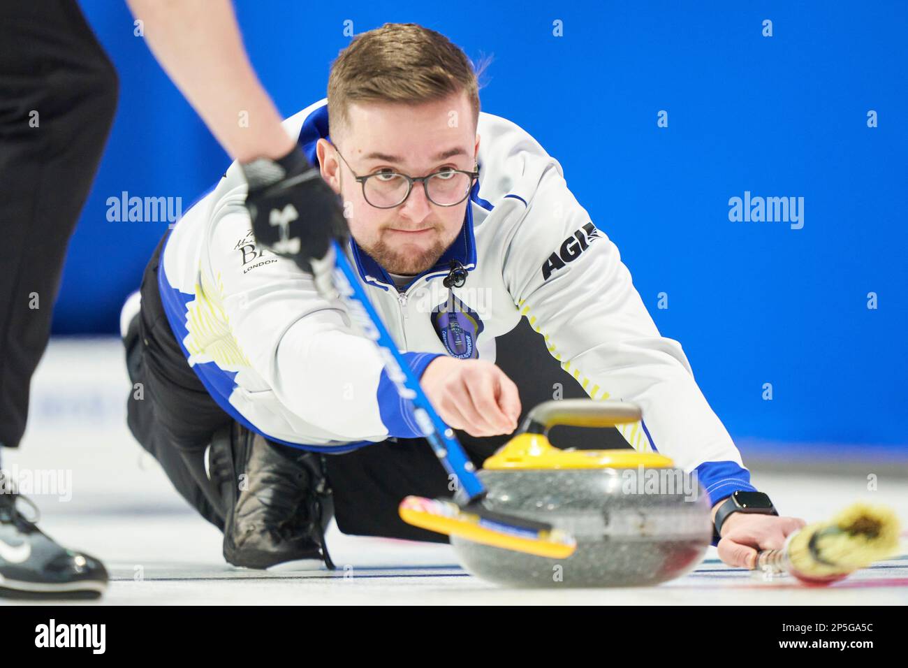 British Columbia skip Jacques Gauthier throws a rock during British ...