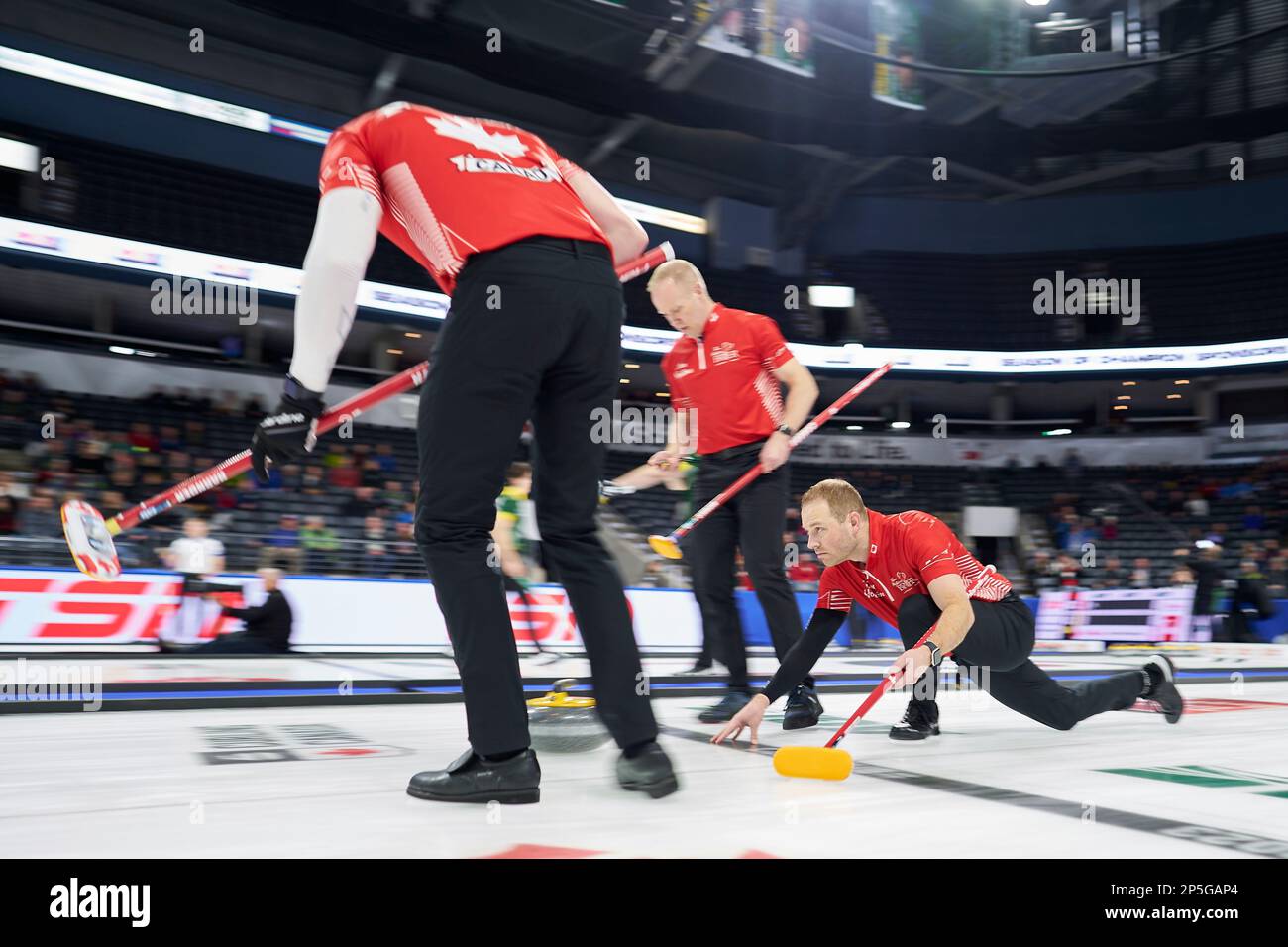 Team Canada lead Geoff Walker throws a stone against Prince Edward ...