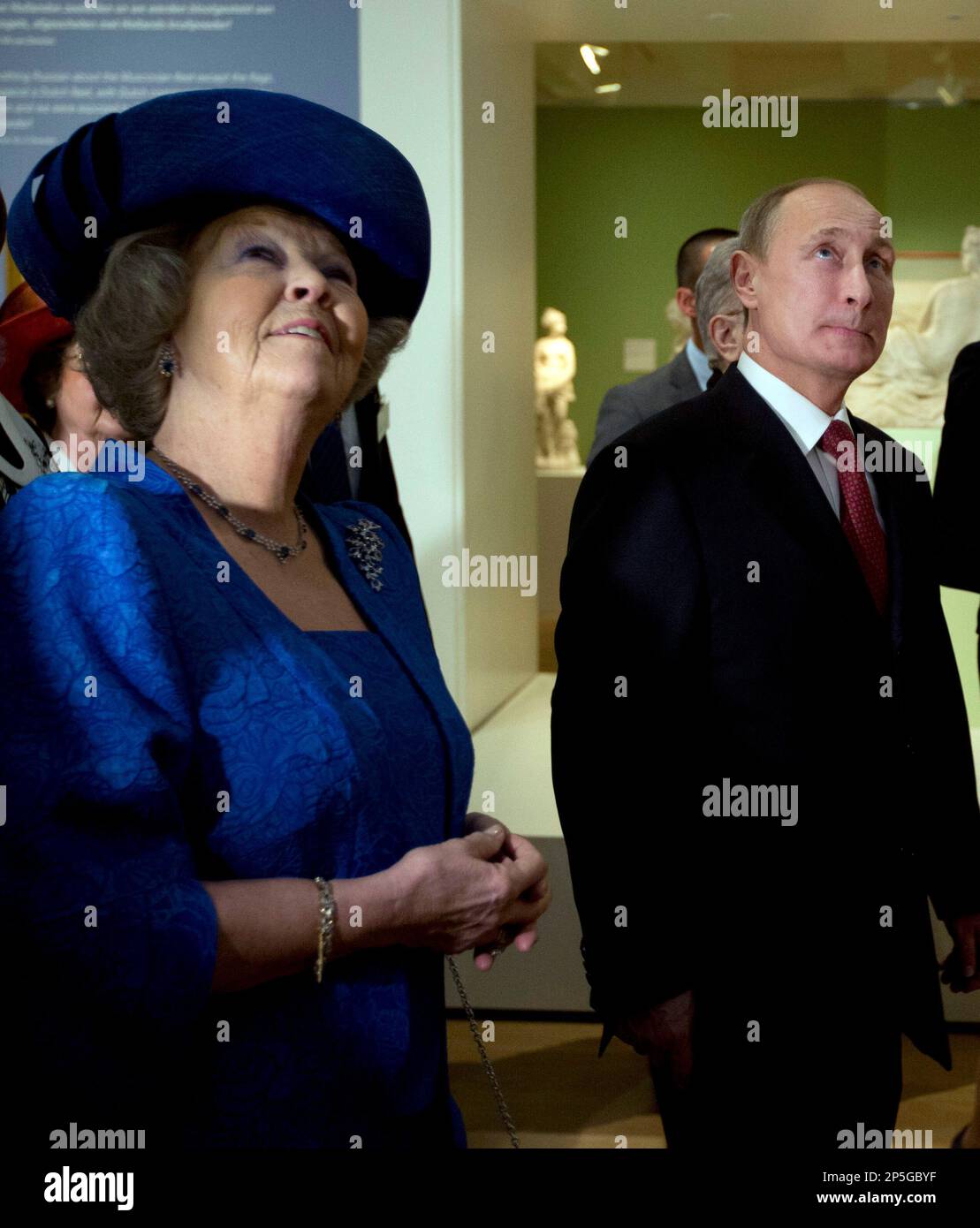 Dutch Queen Beatrix, left, and Russian President Vladimir Putin, right ...