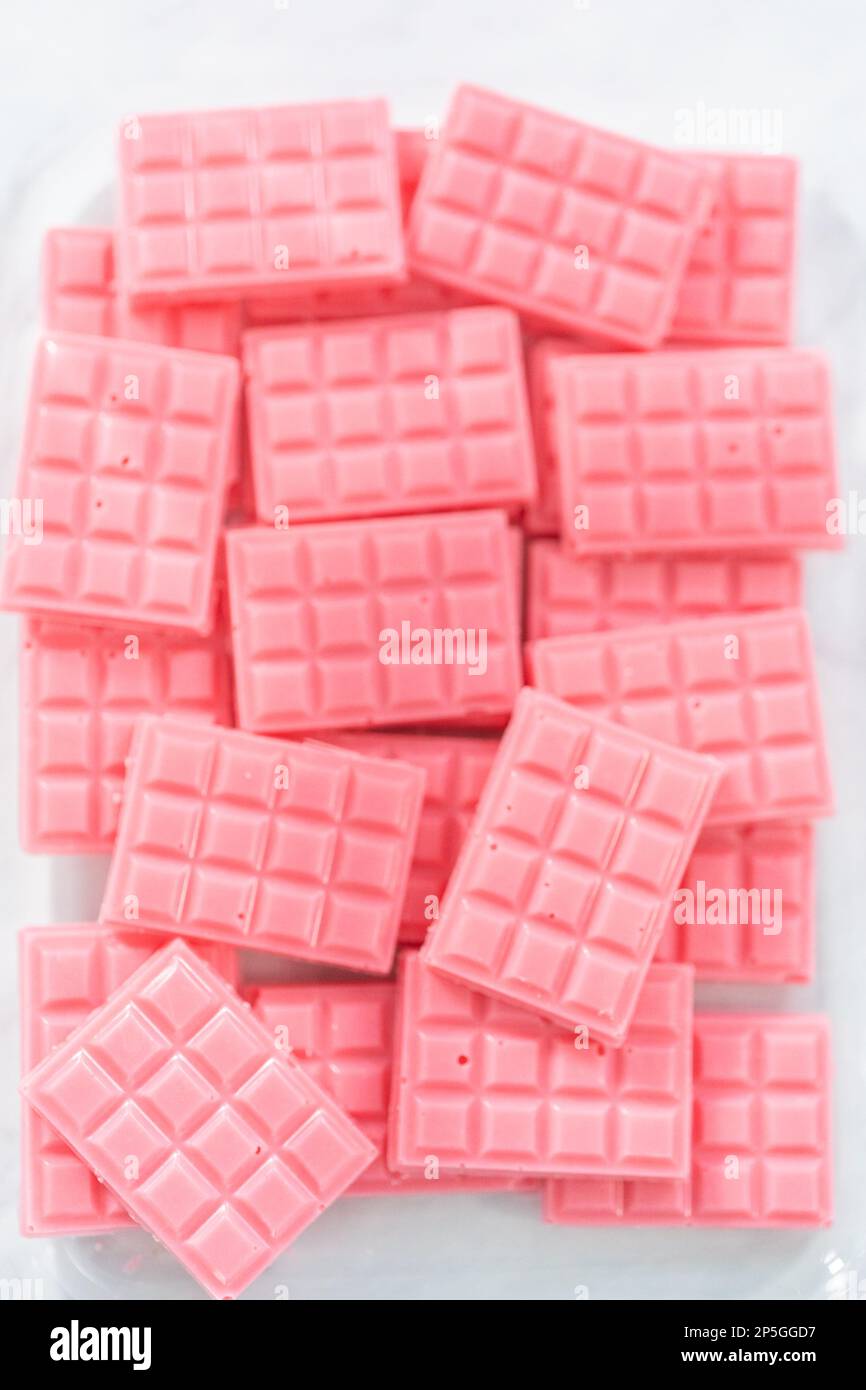 Mini pink chocolates Stock Photo - Alamy