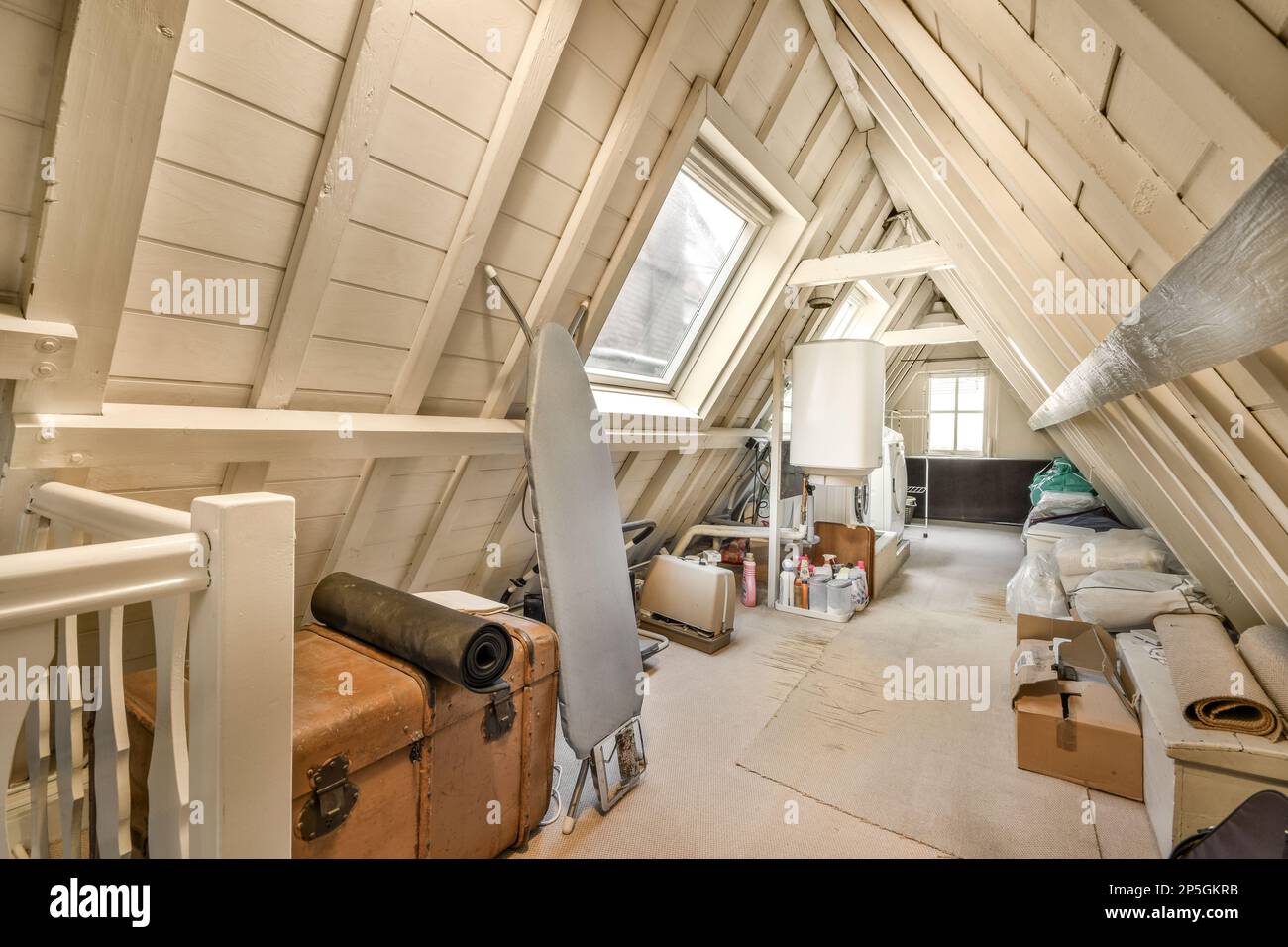 an attic with wood sidings on the walls and flooring boards all over ...
