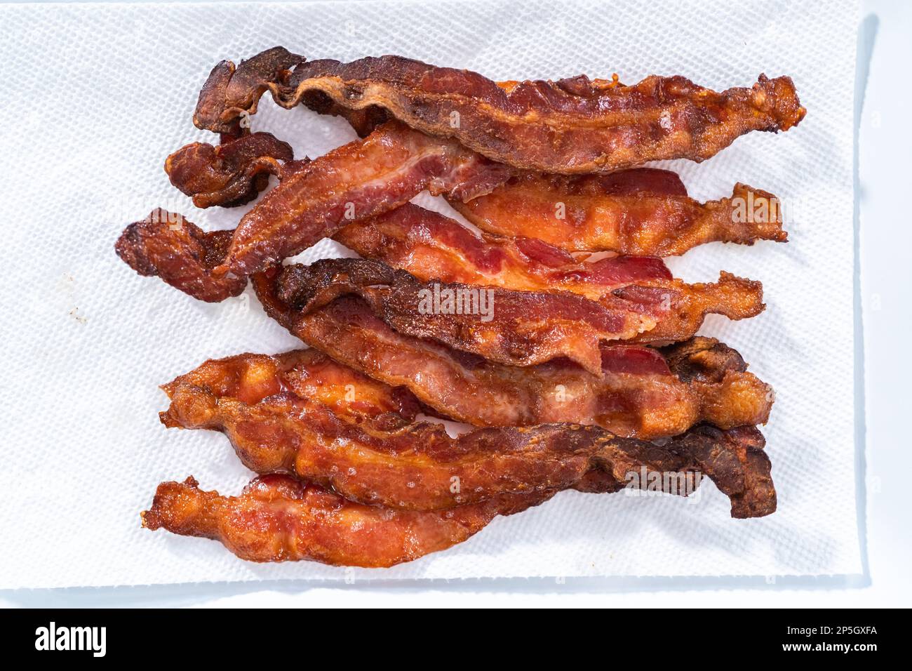 Cooking bacon strips Stock Photo - Alamy