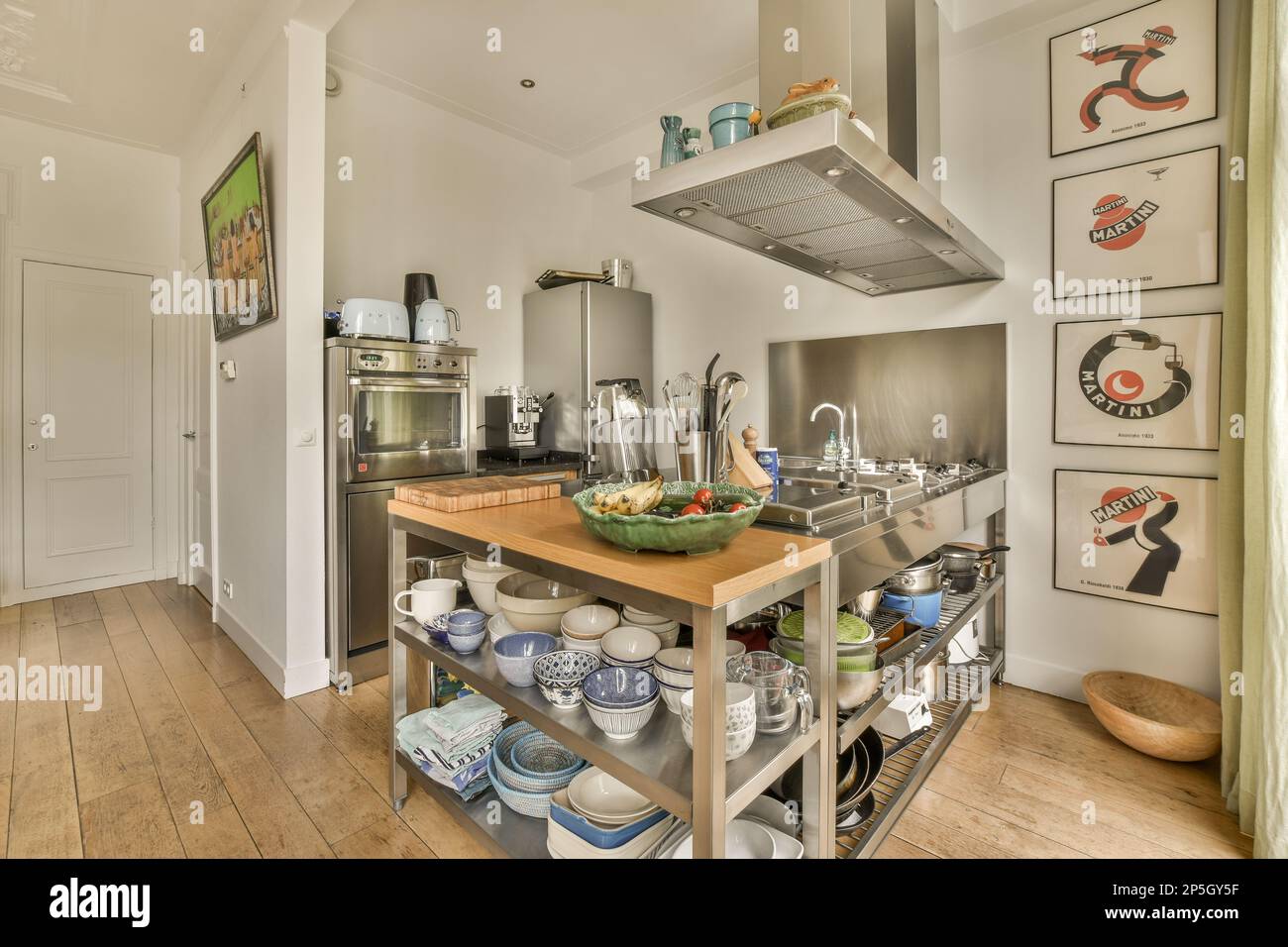 a kitchen with lots of dishes on the counters and in the center of the ...