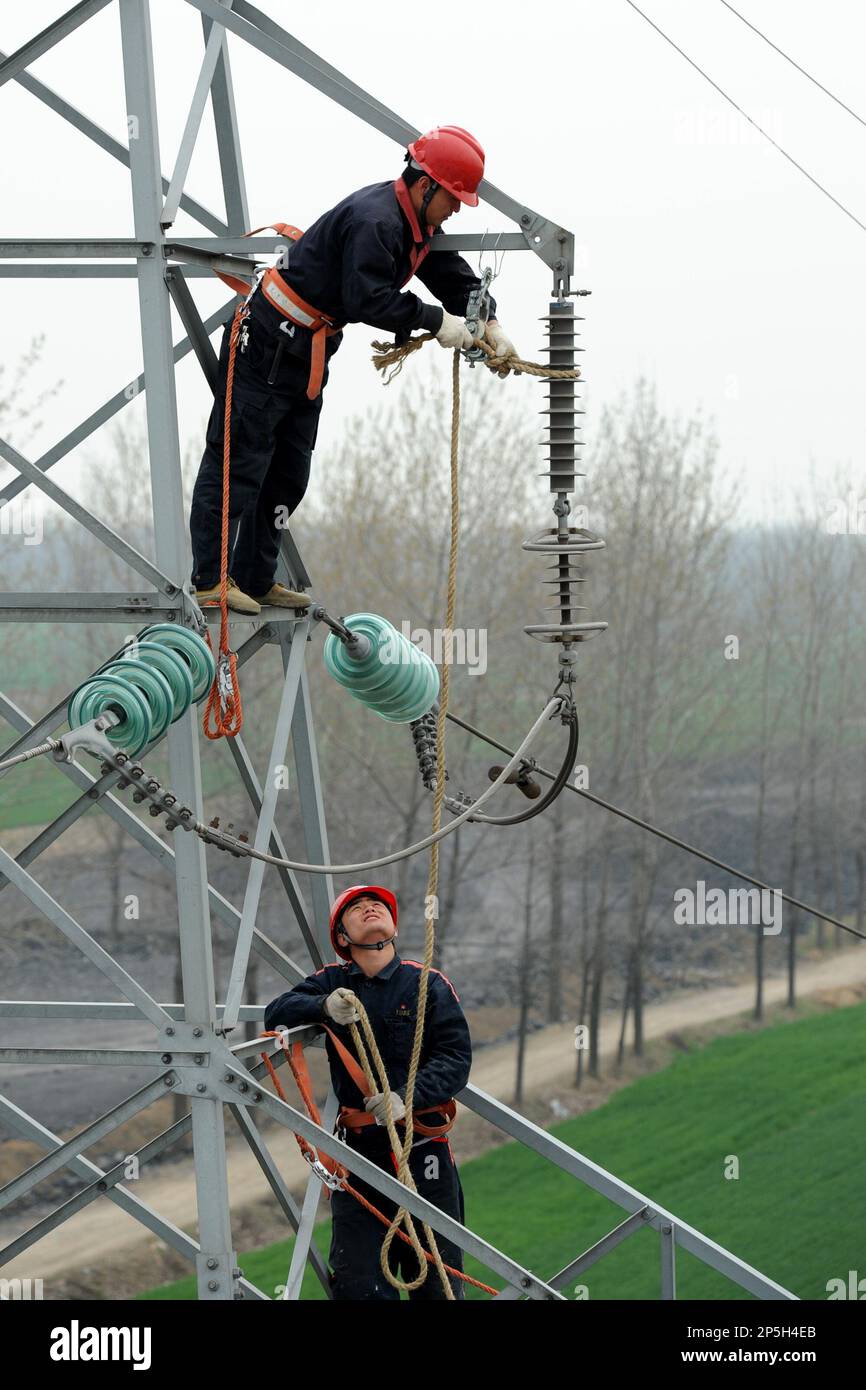 Technicians maintained 35kv high voltage transmission line in high ...