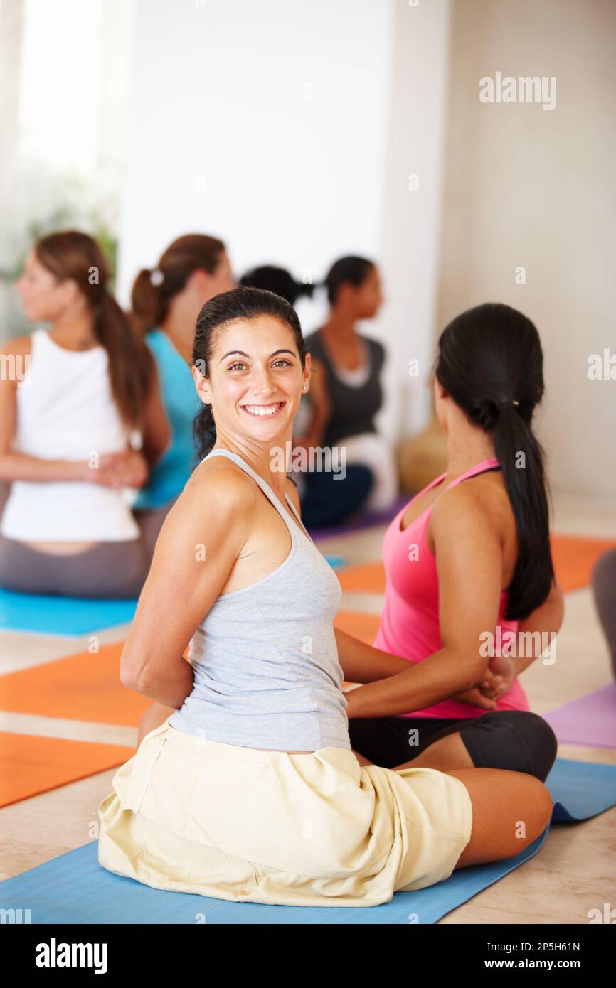 Yoga refreshes and relaxes her. Portrait of a happy pretty woman ...