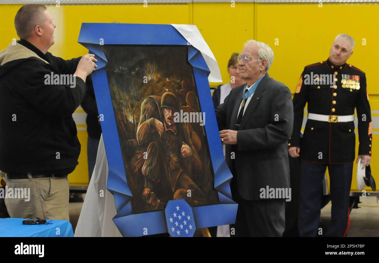 Artist Bryan Mosier, at left, with Ernie West, (center) unveil the ...