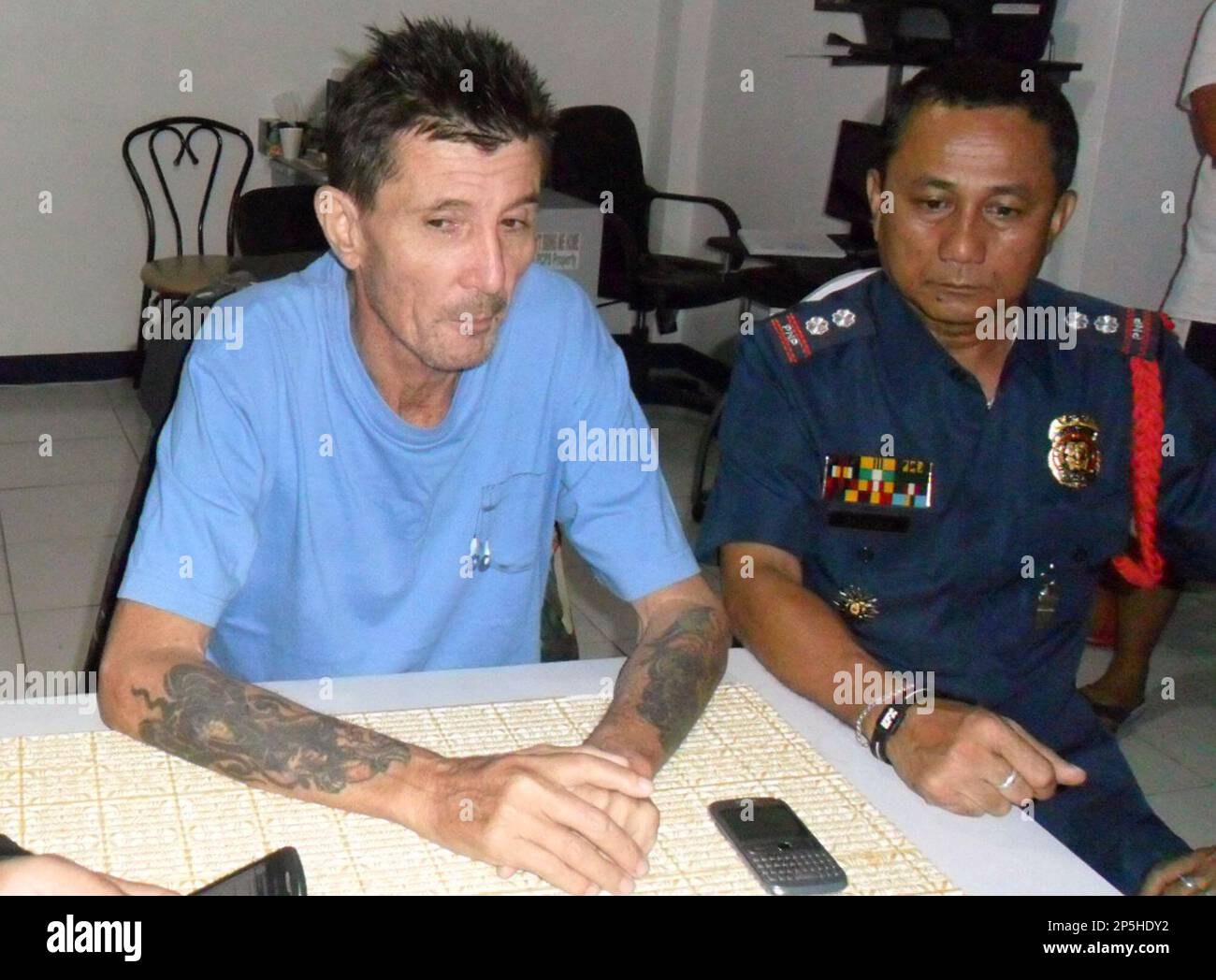 Australian hostage Warren Richard Rodwell, left, rests inside the ...