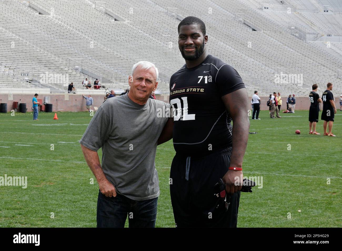 Former Florida State Tackle Menelik Watson, right, poses with his ...