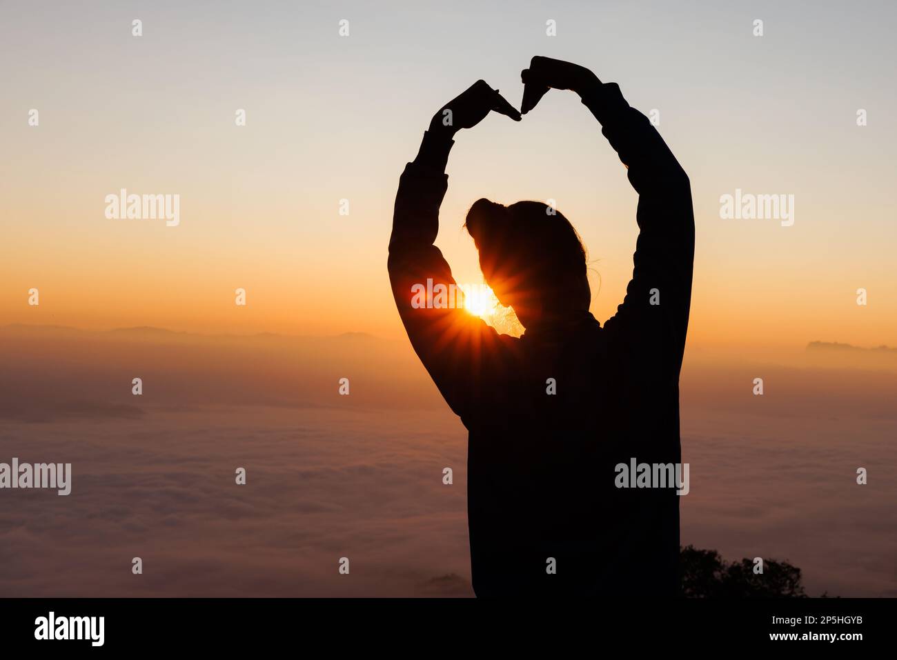 Hands in shape of love heart, Female hands in the form of heart against ...