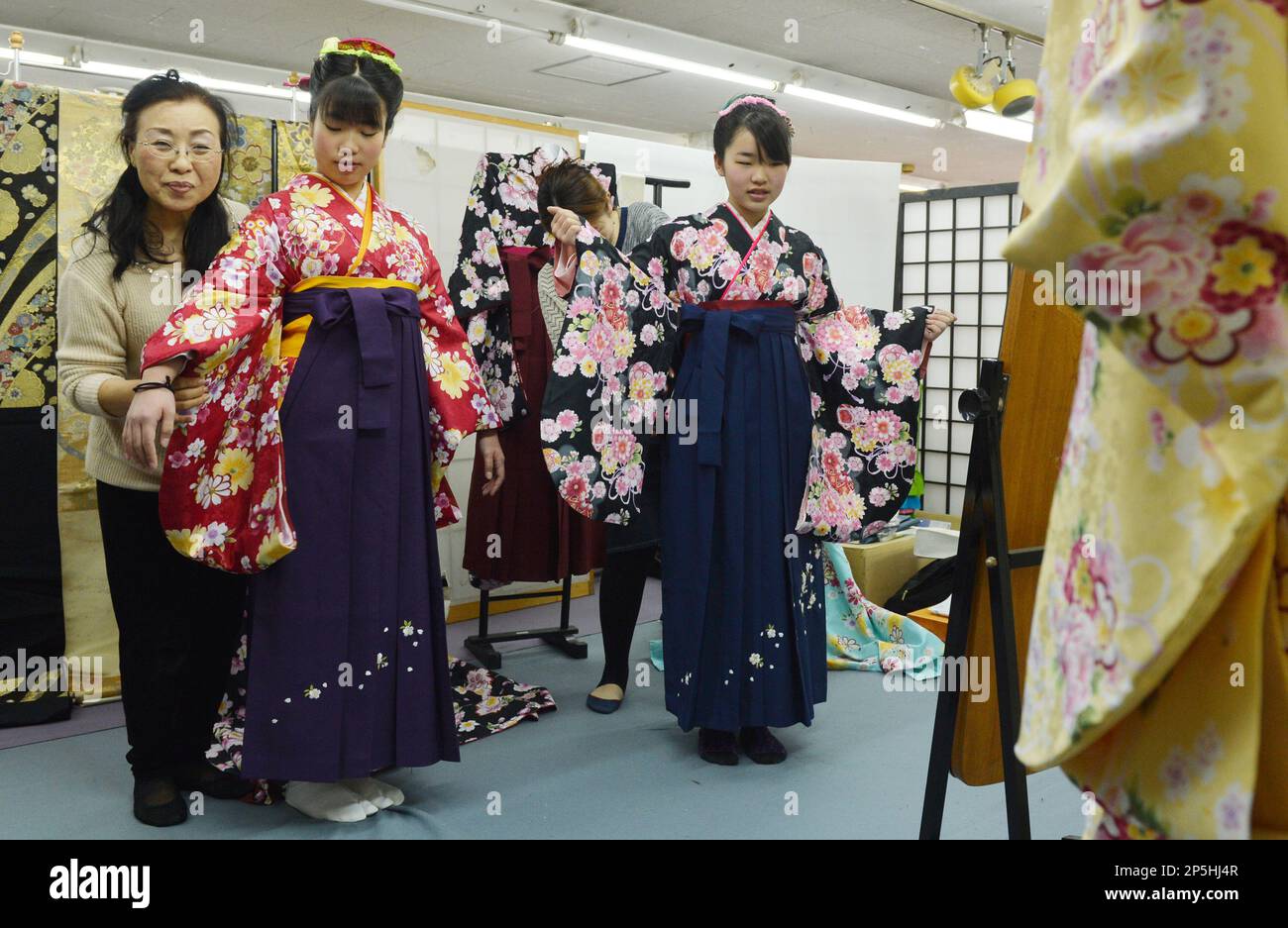 Girls wear kimono for their primary school graduation ceremony in ...