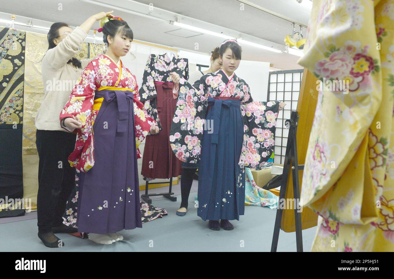 Girls wear kimono for their primary school graduation ceremony in ...