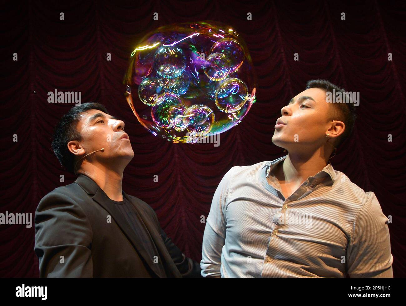 Deni Yang (R), bubble artist and son of the famed Fan Yang (L) who ...