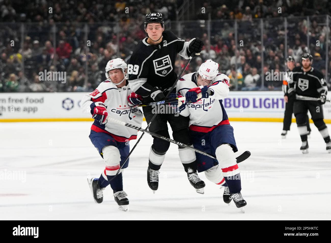 Los Angeles Kings' Rasmus Kupari (89) collides with Washington Capitals ...