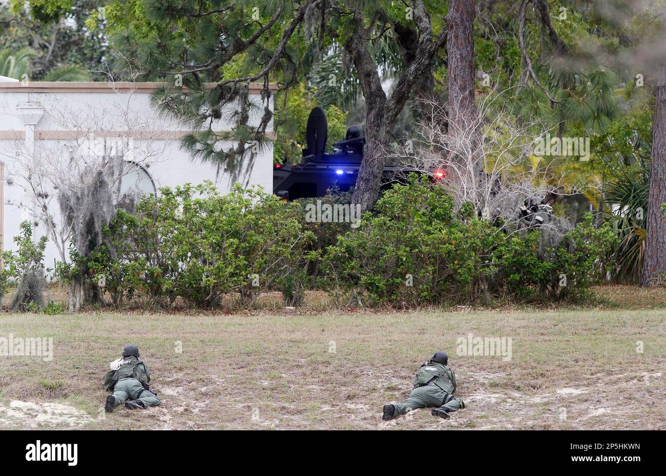 Pasco SWAT team members surround the perimeter of the house where James ...