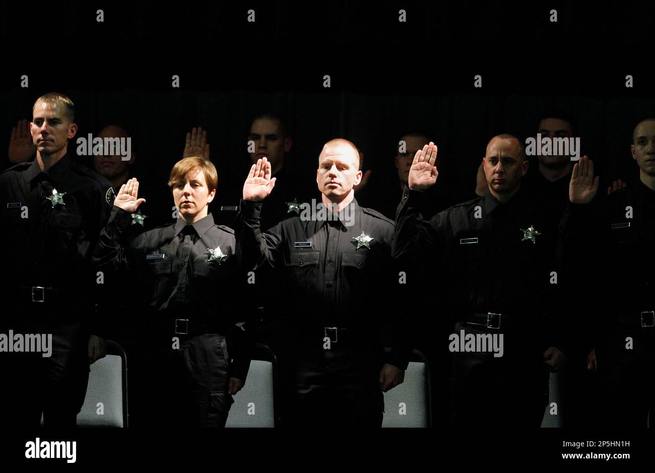 In this photo taken Sunday, March 17, 2013, twenty three newly hired ...