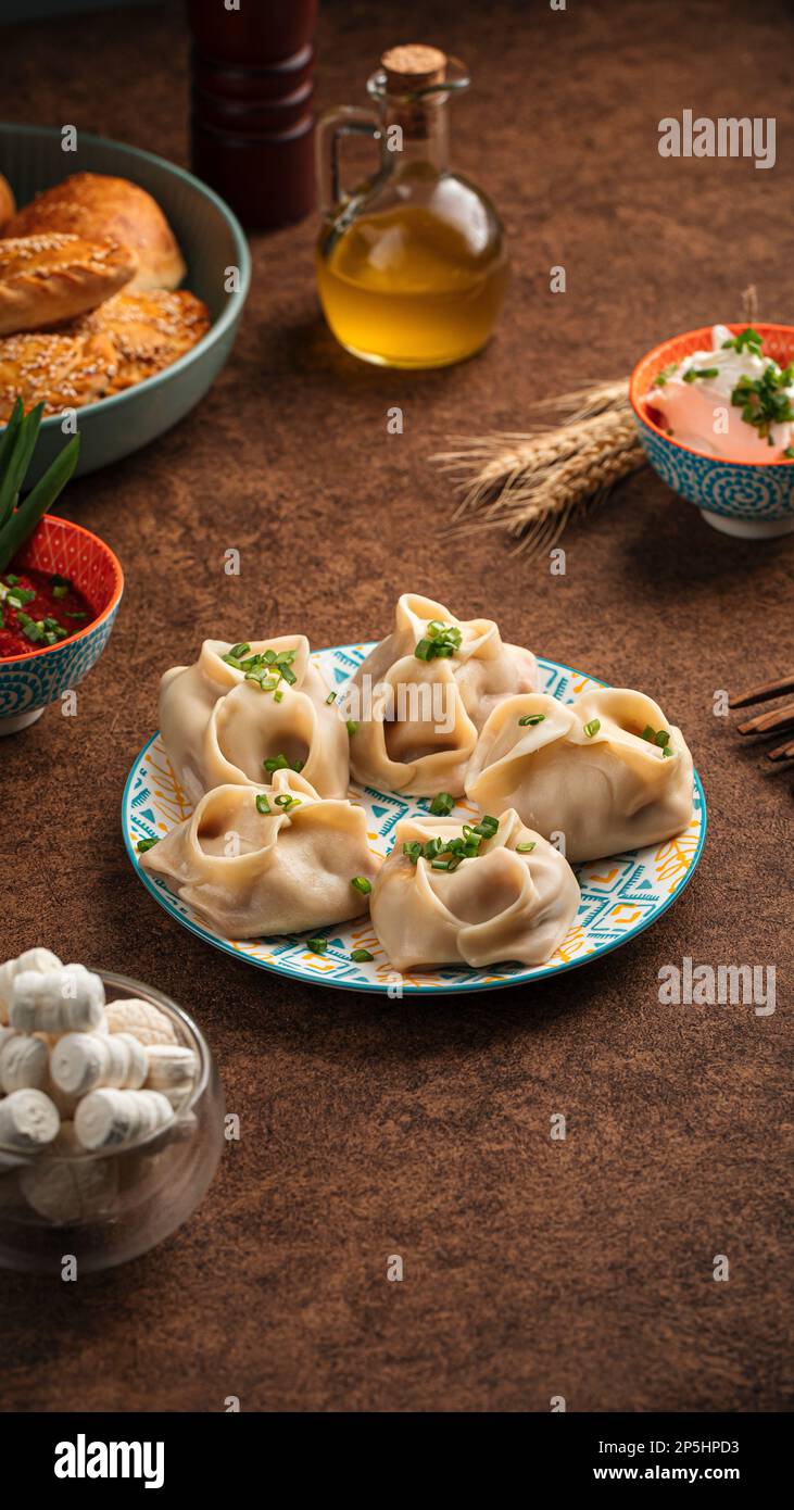 Portion of steamed tatar manti dumplings Stock Photo - Alamy
