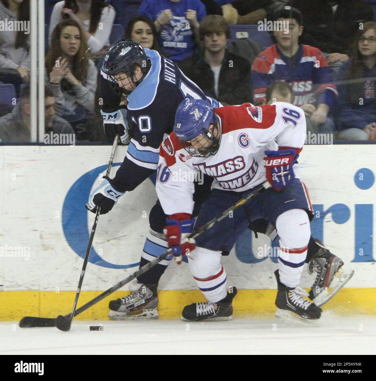 Maine's Ben Hutton (10) and Massachusetts-Lowell's Riley Wetmore (16 ...