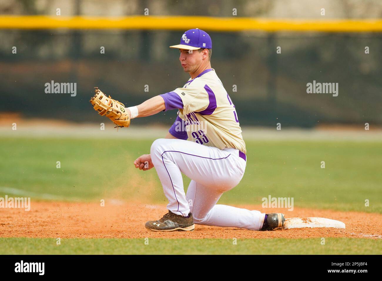 Western Carolina Catamounts first baseman Austin Neary (33) digs out a ...