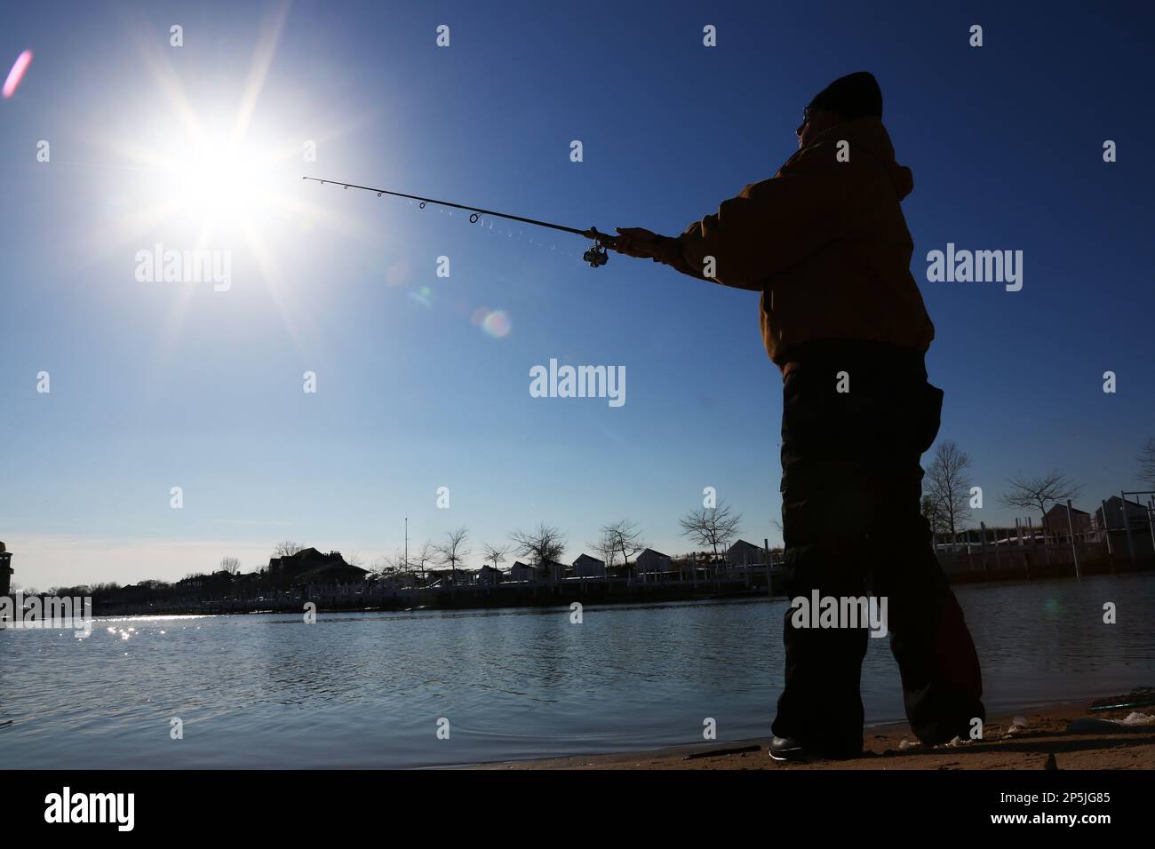 Mike Lindley casts off towards the sun during a mild winter day on the ...