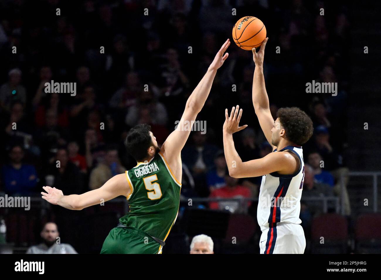 Gonzaga forward Anton Watson, right, shoots against San Francisco center Saba Gigiberia (5 ...