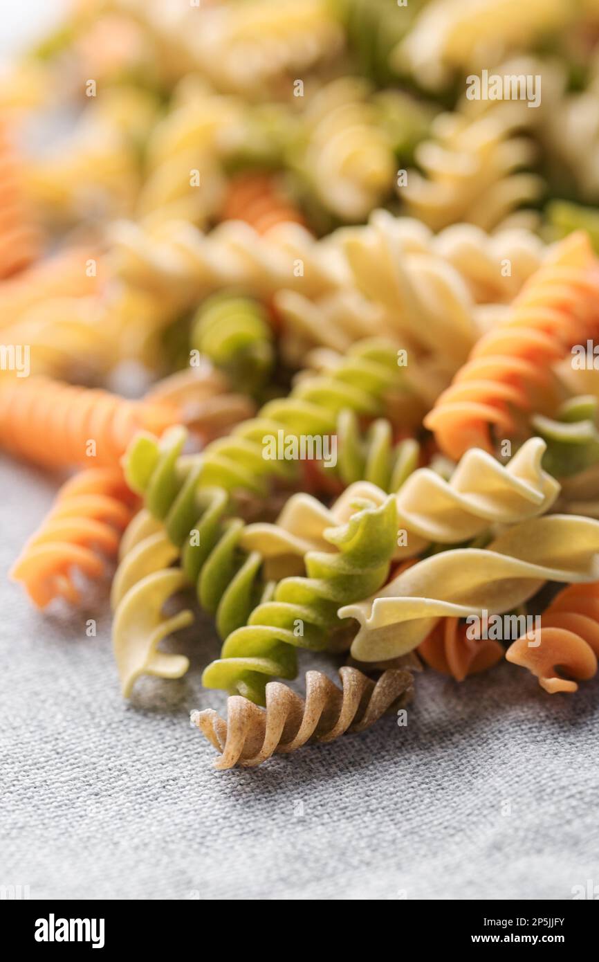 A variety of fusilli pasta made from different types of legumes, green ...