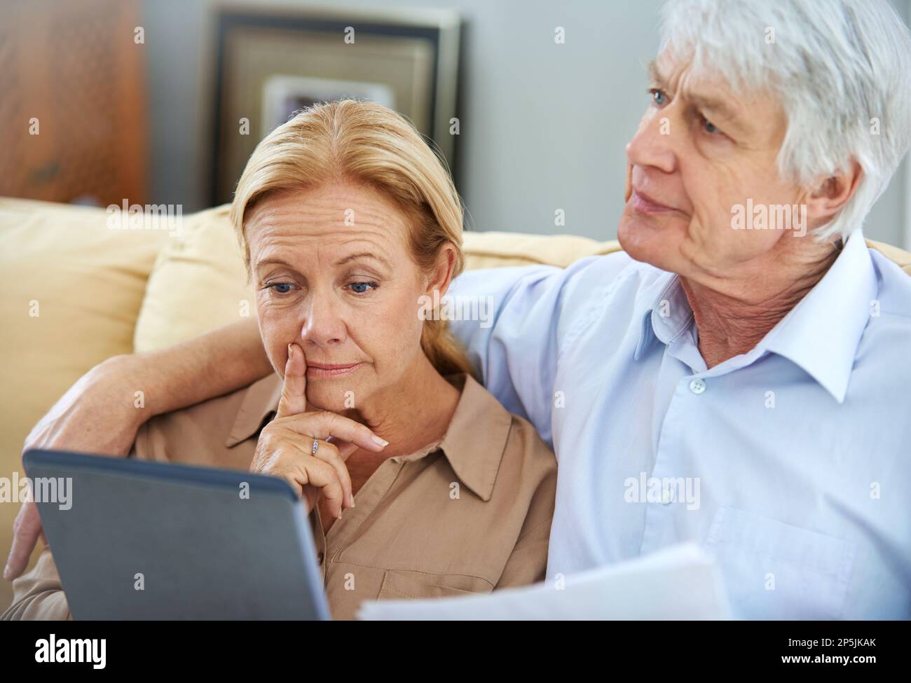 Making an informed decision. an elderly couple going over their ...