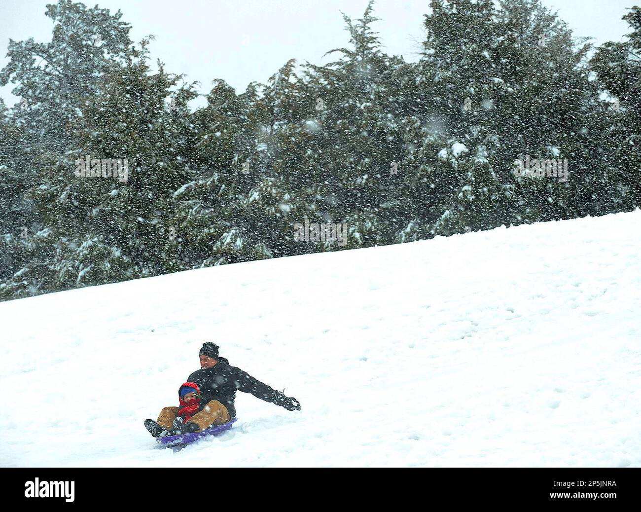 Marcus Pomeroy and his some William slide down Trench Hill in ...