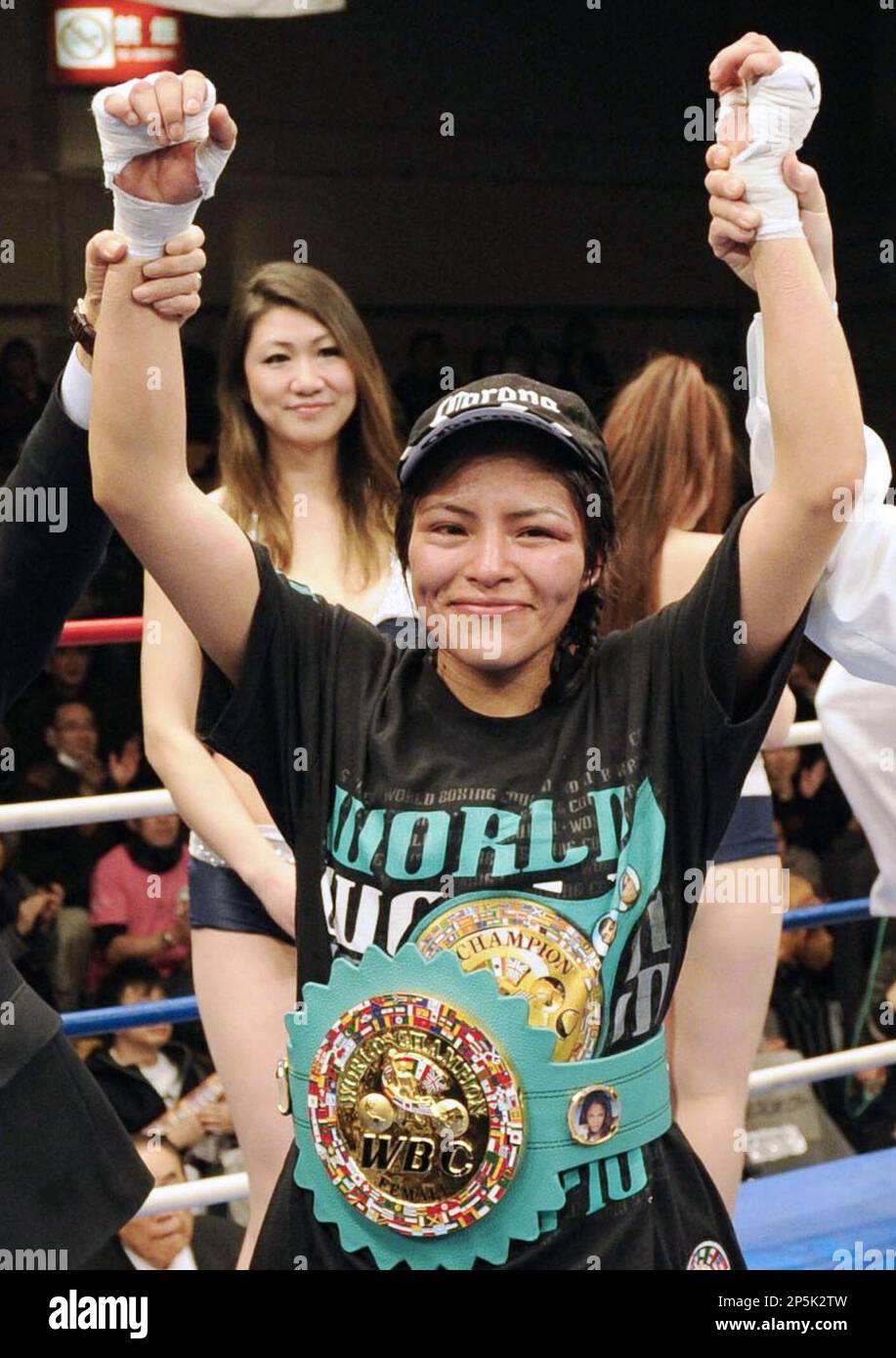 Ibeth Zamora of Mexico has her arms raised after her win over Naoko ...
