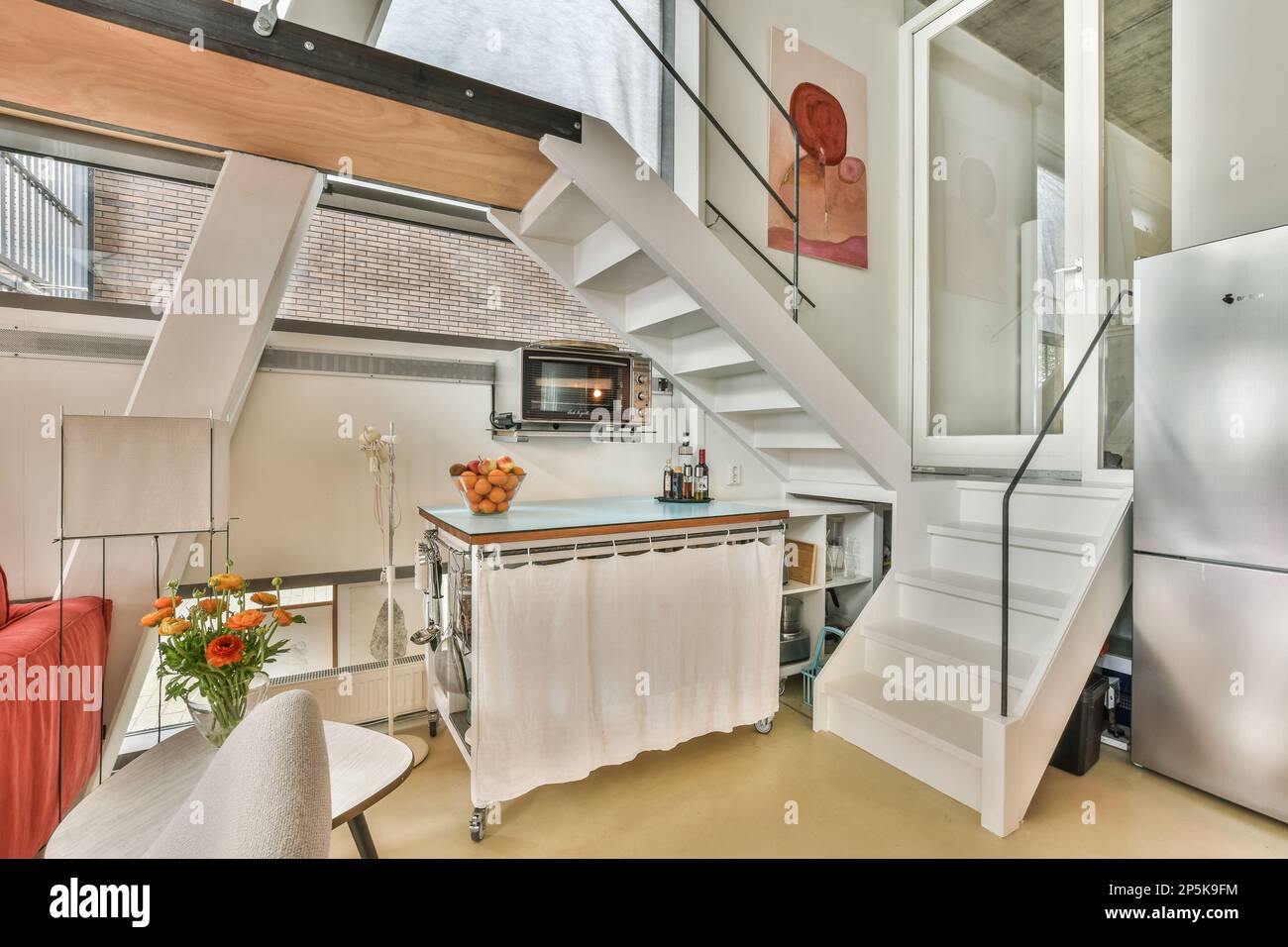 Amsterdam, Netherlands - 10 April, 2021: a kitchen and stairs in a room ...