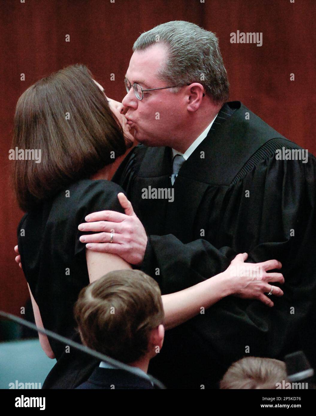 Matthew W. Brann, of Canton, kisses his wife, Laura, after taking his ...