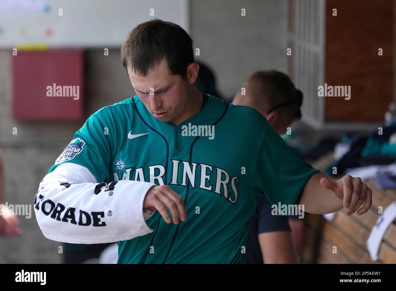 Seattle Mariners starting pitcher Chris Flexen pauses in the dugout ...