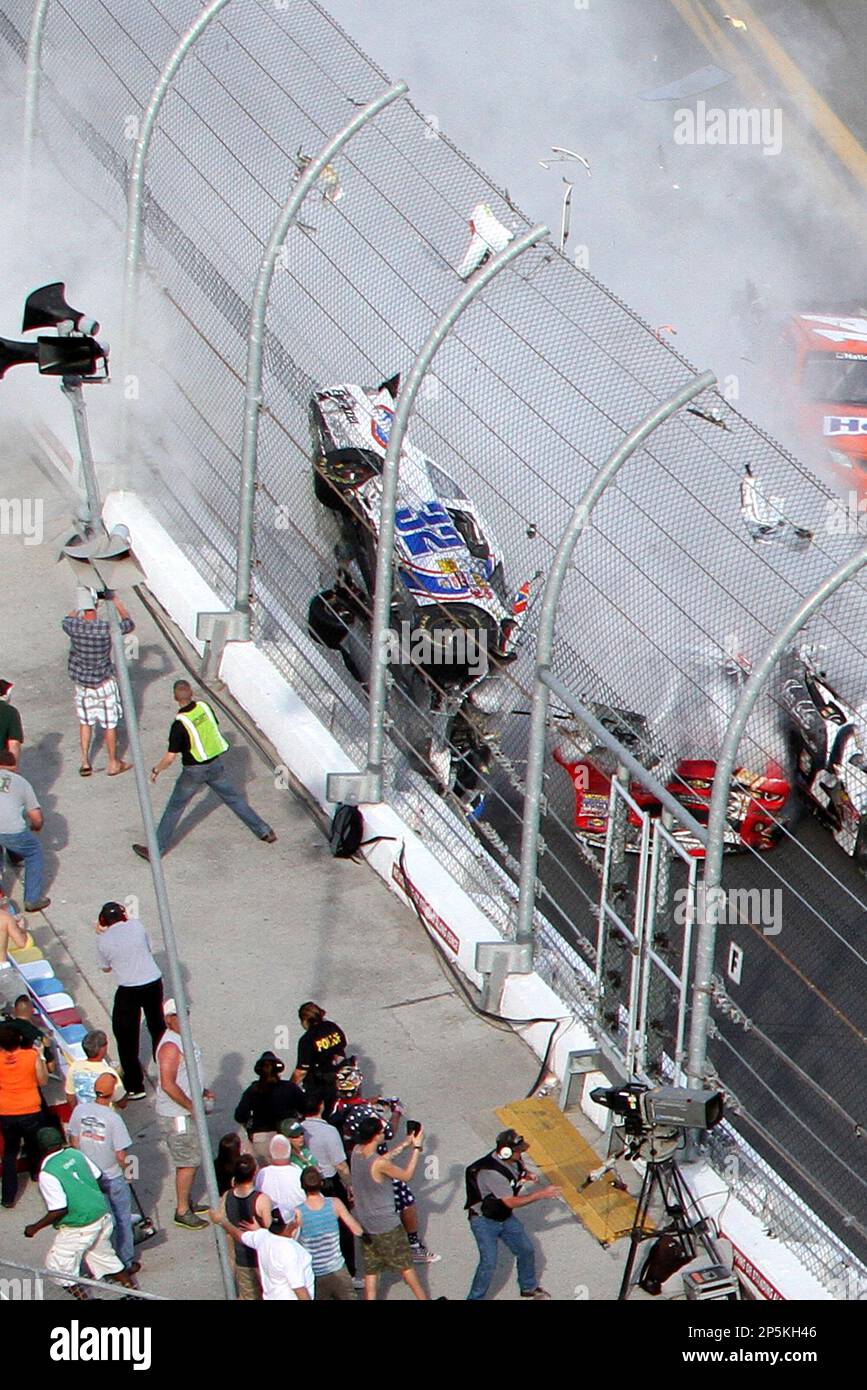 A horrific wreck of NASCAR driver Kyle Larson occurs with debris flying ...