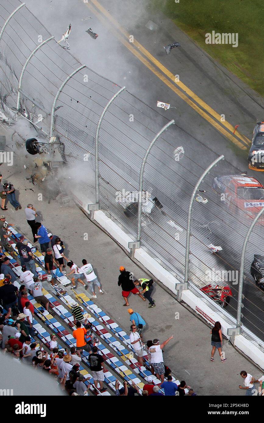 A horrific wreck of NASCAR driver Kyle Larson occurs with debris flying ...