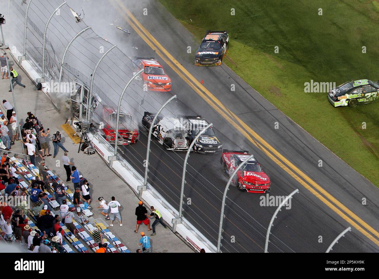 A horrific wreck of NASCAR driver Kyle Larson occurs with debris flying ...