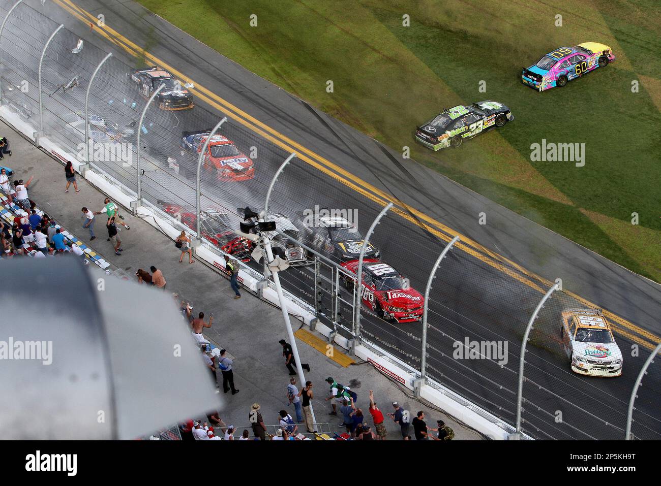 A horrific wreck of NASCAR driver Kyle Larson occurs with debris flying ...