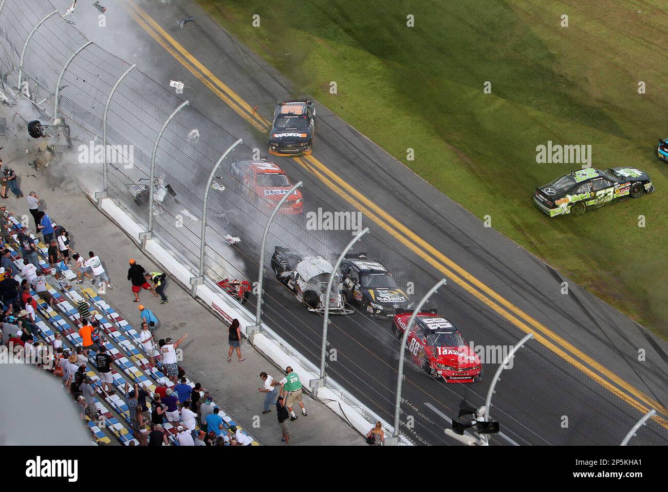 A horrific wreck of NASCAR driver Kyle Larson occurs with debris flying ...