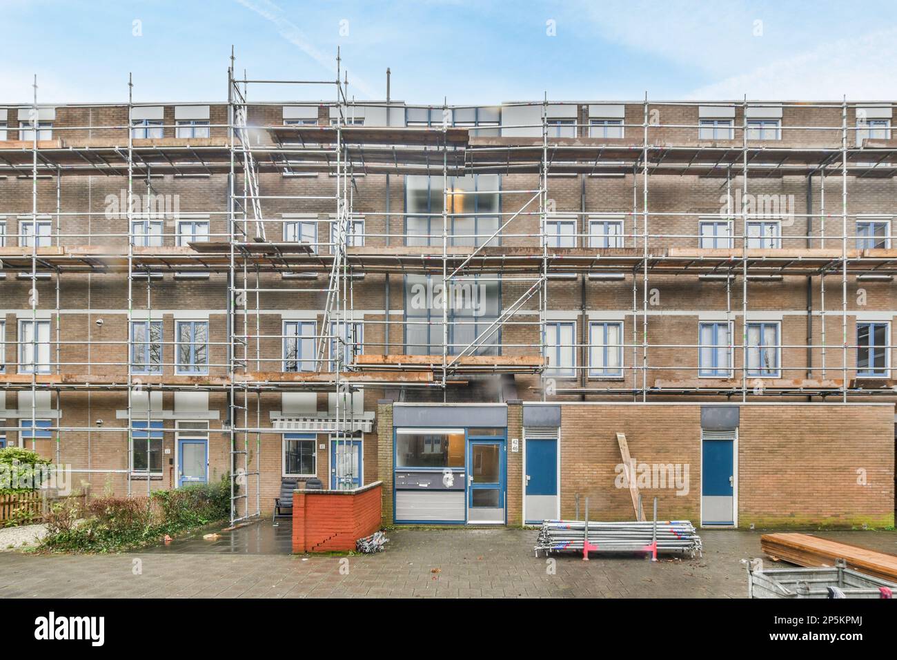 a building under construction with scafs on the roof and ladders ...